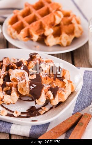Waffles with chocolate cream and hazelnuts Stock Photo - Alamy
