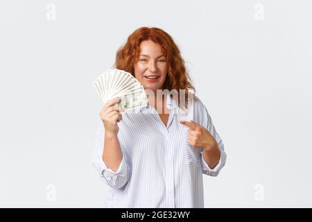 Beautiful middle age mature rich woman wearing leopard dress over ...