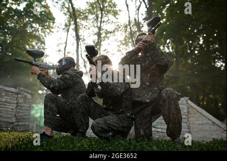 Paintball team, battle on playground in the forest Stock Photo - Alamy