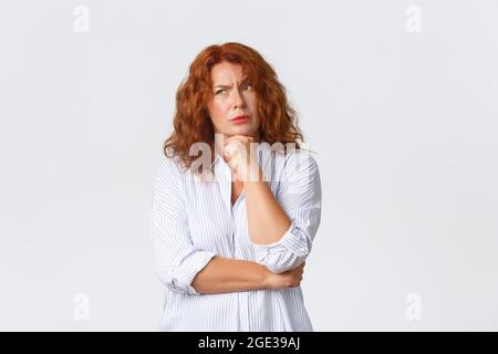 indecisive businesswoman in white shirt on grey background, ceo Stock ...