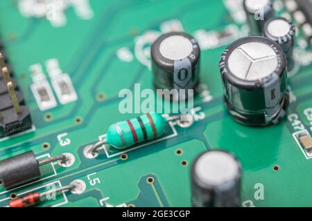 Close up of resistor-like through-hole black ferrite bead component on ...