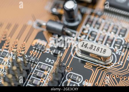 Quartz crystal oscillator resonator on a pcb. Oscillators provide an ...