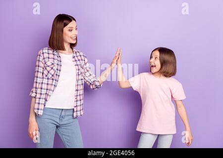Positive little sisters clapping their hands Stock Photo - Alamy