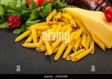 Raw penne rigate with vegetables for cooking Stock Photo - Alamy