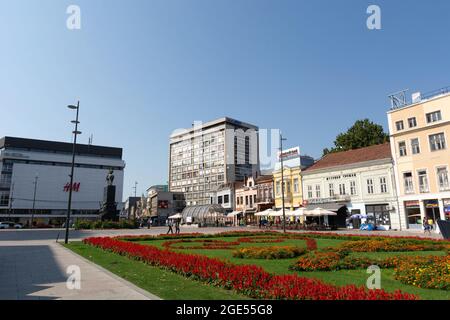 Nis, Serbia - August 14, 2021 People walk the paved promenade in the ...