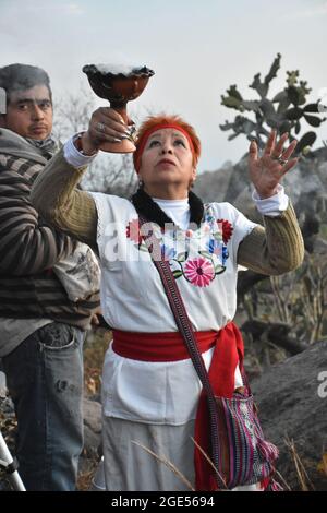 An indigenous shaman performs a ritual to the four cardinal points ...