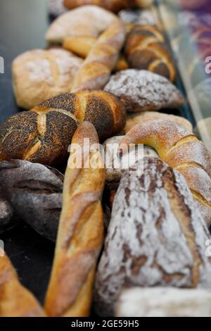 Fresh bread on a counter of the grocery store. Industry Stock Photo - Alamy