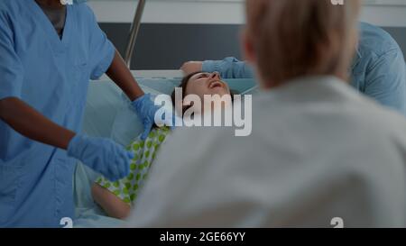 Screaming woman giving birth to child at maternity in hospital ward ...