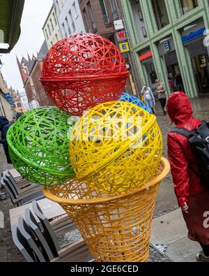Stralsund, Germany. 17th Aug, 2021. Walkers are out in the rain in the ...
