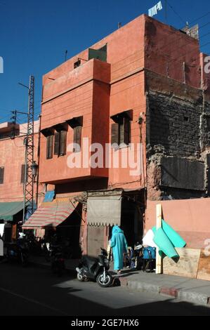 MARRAKESH, MOROCCO - Jul 25, 2021: An old street with red buildings and ...