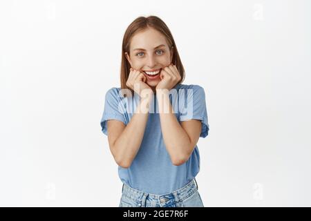 Beautiful woman with blue eyes expecting a baby, touching pregnant ...