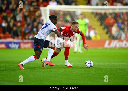 Pelly Ruddock #17 of Luton Town and Cauley Woodrow #9 of Barnsley ...
