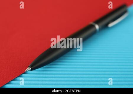 Office ballpoint pen lies on a sheet of paper close-up Stock Photo - Alamy