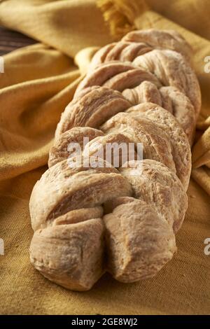 Vertical shot of tasty braided homemade bread on a tablecloth Stock ...