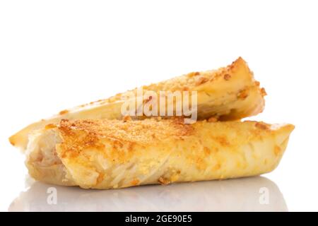 Two mini strudel with an apple on a paper bag with a cup of kefir ...