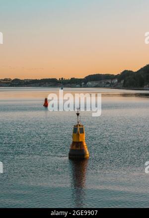 Vertical shot of a buoy floating in the middle of the ocean Stock Photo ...