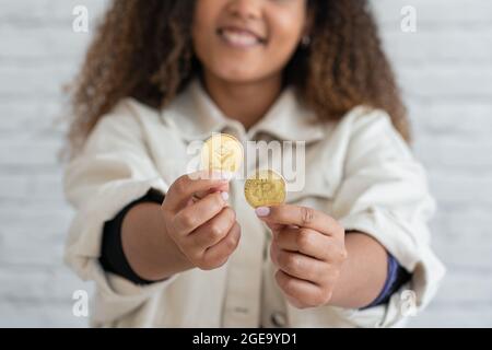 Unrecognizable black girl holding cryptocurrency with hands Stock Photo ...
