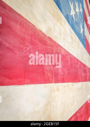 Forced perspective close-up abstract of faded and weathered American ...