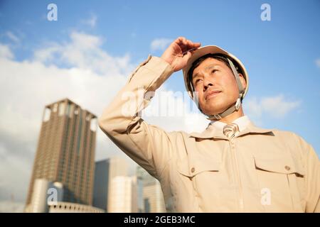 Japanese worker at construction site Stock Photo - Alamy