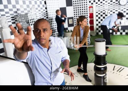 Quest player is looking for a key to exit room Stock Photo - Alamy