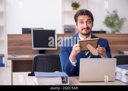 Young employee missing girlfriend at workplace Stock Photo - Alamy