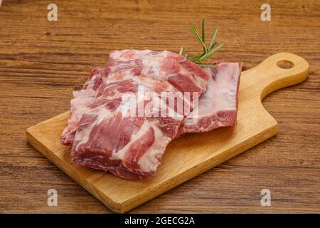 Raw pork ribs served rosemary for cooking Stock Photo - Alamy