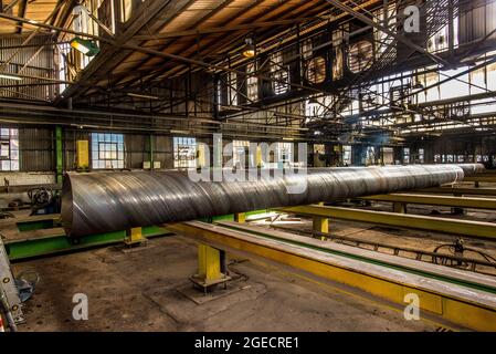 Pipe manufacturing plant. Large diameter Metal pipes factory Stock ...