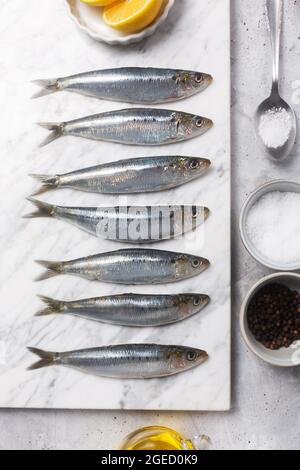 Freshly caught fresh sardines from the Mediterranean sea on the gray ...