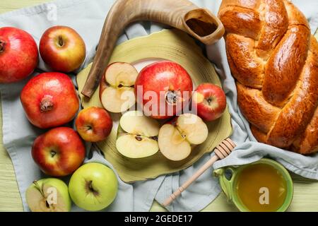 Honey with fruits and challah on color wooden background. Rosh hashanah ...