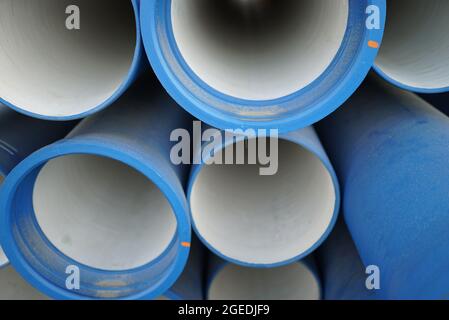Closeup shot of a stack of blue casing pipes Stock Photo - Alamy