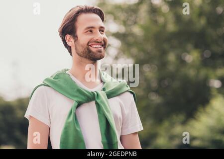 Profile photo of interested young brunette lady point look empty space ...