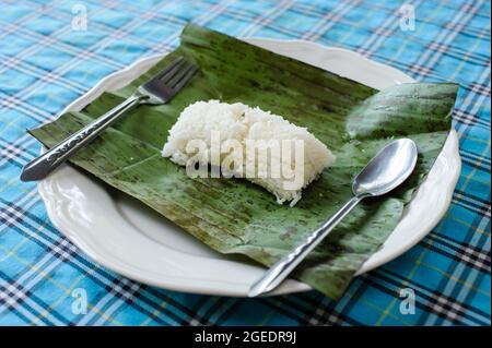 steamed rice with banana leaf spoon and folk on a dish Stock Photo - Alamy