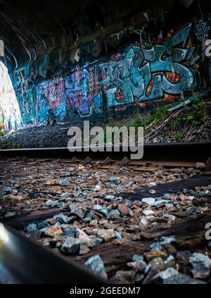 metal concrete stone bridge with rails over the river Stock Photo - Alamy