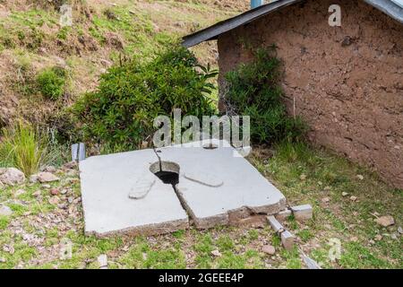 Open air toilet in a village on Amantani island in Titicaca lake, Peru ...