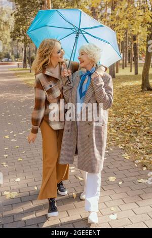Hello september. happy young woman in beige coat with autumn yellow ...
