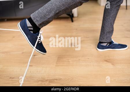 Trip Over Wire Cable Or Cable And Fall Stock Photo - Alamy