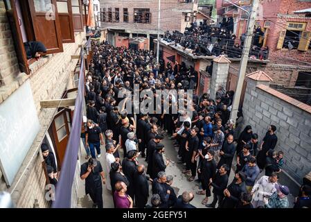 Shia Muslim mourners beat their chests during a religious procession on ...