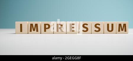 The German word Impressum built from letters on wooden cubes. High ...