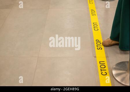 Stop sign yellow line at marble floor warning Stock Photo - Alamy