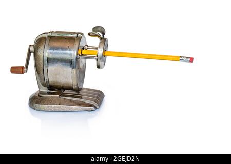 Old retro pencil sharpener (made of steel) isolated on white. Antique ...