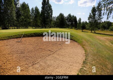 Golf course in the middle of the forest glade Stock Photo - Alamy