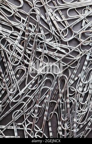 Silver paper clips textured background, full screen Stock Photo - Alamy