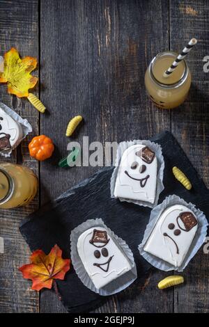 Halloween sweets on wooden background Stock Photo - Alamy