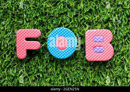 Alphabet letter in word FOB (abbreviation of free on board) on wood ...