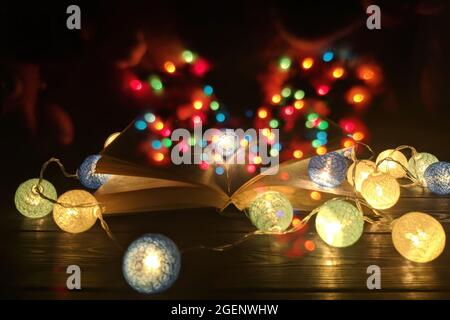 fantasy reading magical image of open antique book over wooden table ...
