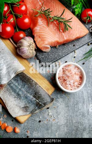 Raw fishes and vegetables on stone background, healthy food Stock Photo ...