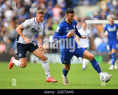 Millwall's Daniel Ballard (left) and Cardiff City's Mark Harris battle ...
