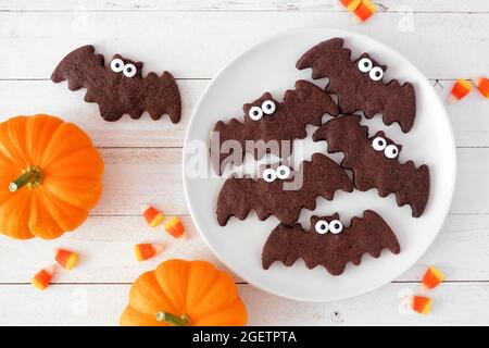 Halloween bat cookies on white background Stock Photo - Alamy