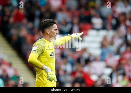 Lee Nicholls #21 of Huddersfield Town makes a save from Leif Davis #20 ...