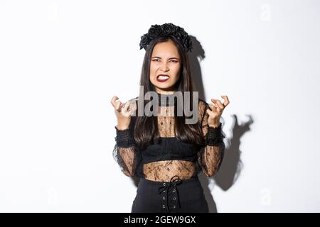 Image of angry wicked witch cursing and swearing, clenching fists and ...